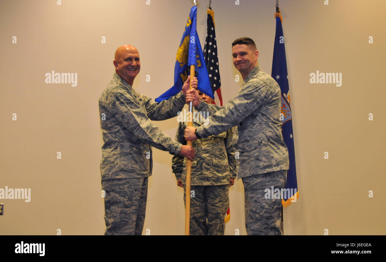 Lt. Col. Jay D. Johnson, 403rd Maintenance Group commander, hands over ...