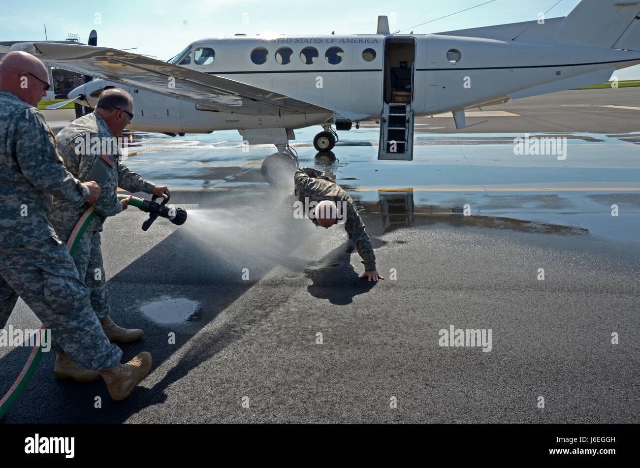 Maj. Gen. Frank Vavala and Chief Warrant Officer 4 Dane Dougherty give ...