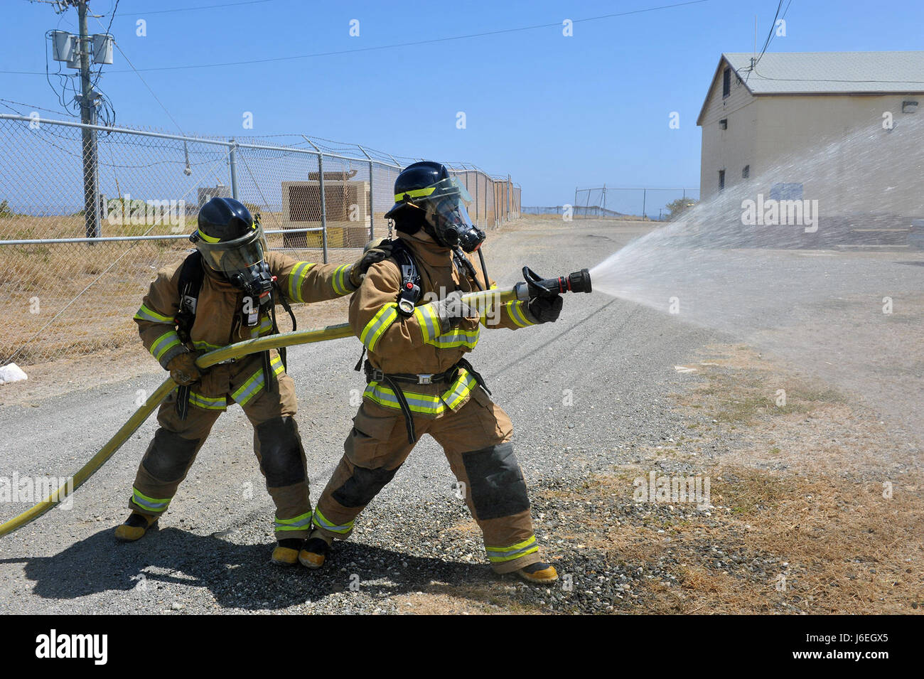 Firefighters Aaron Jackson, right, and David Daley, left, dressed-out ...