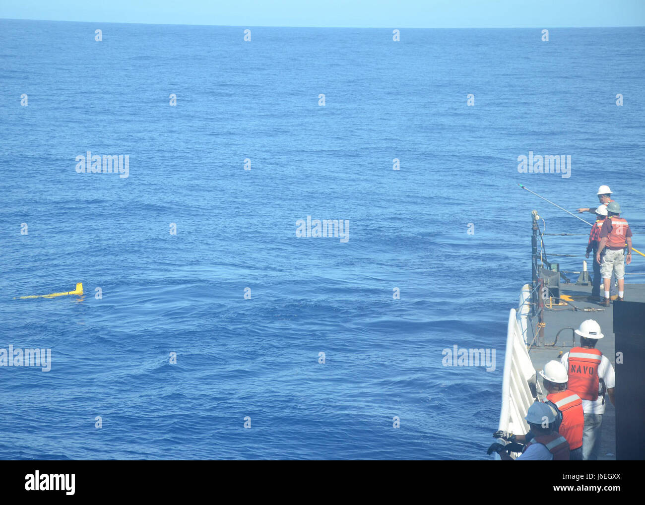 A Naval Oceanographic Office T-AGS 60-class vessel is shown at sea with ...