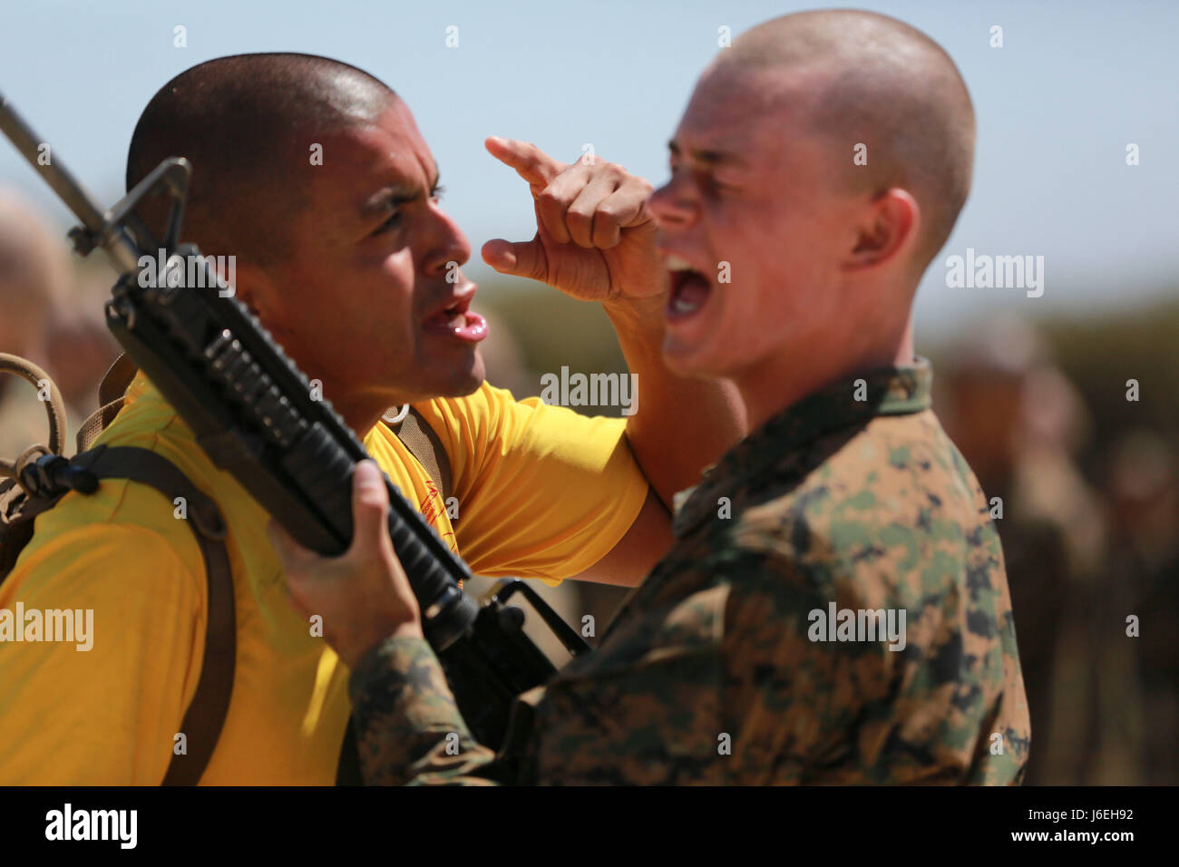A drill instructor from Echo Company, 2nd Recruit Training Battalion, corrects a recruit during ...