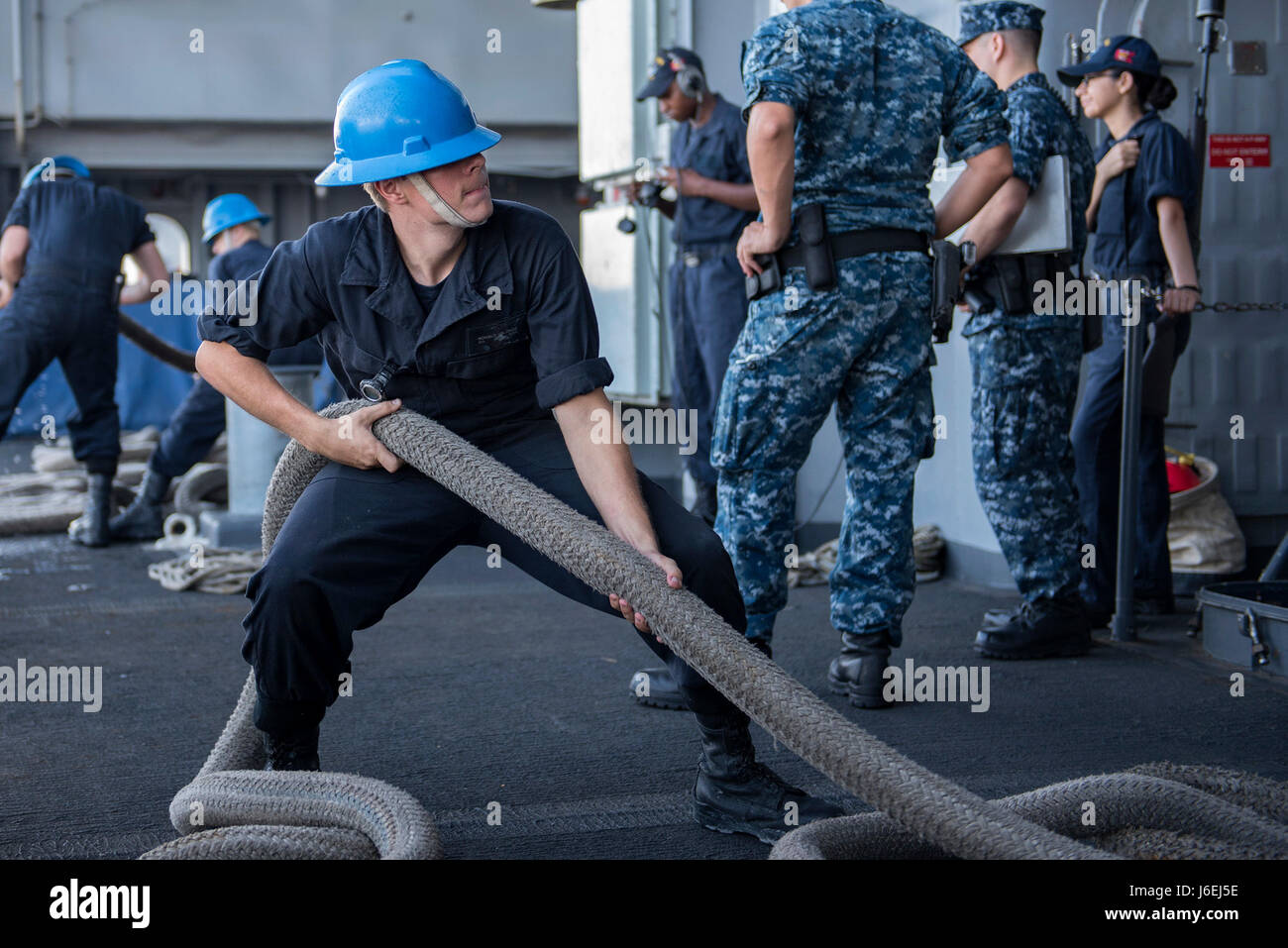 Seaman handles line on the fantail of aircraft carrier USS Harry S ...