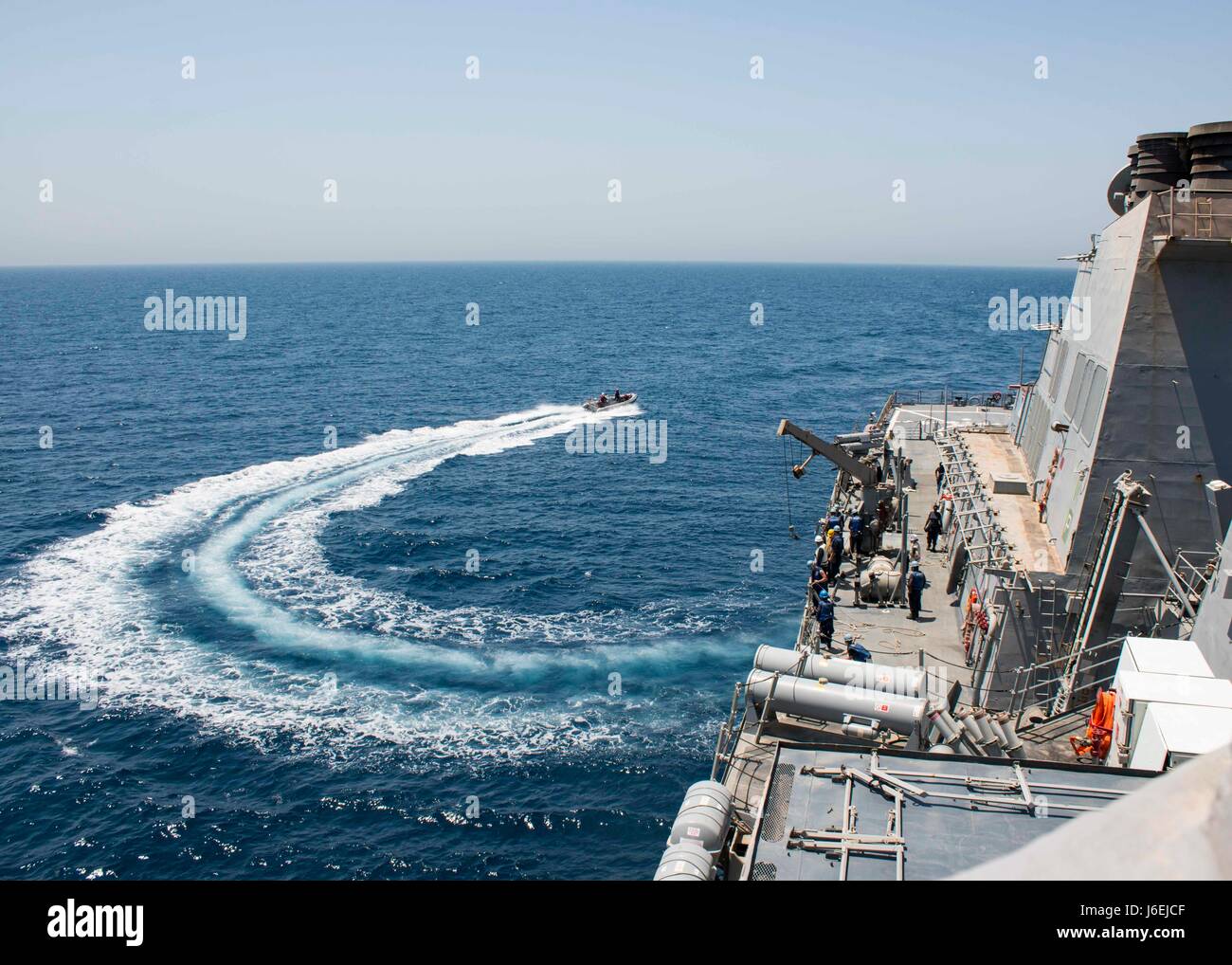 Sailors assigned to guided-missile destroyer USS Stout (DDG 55) recover ...