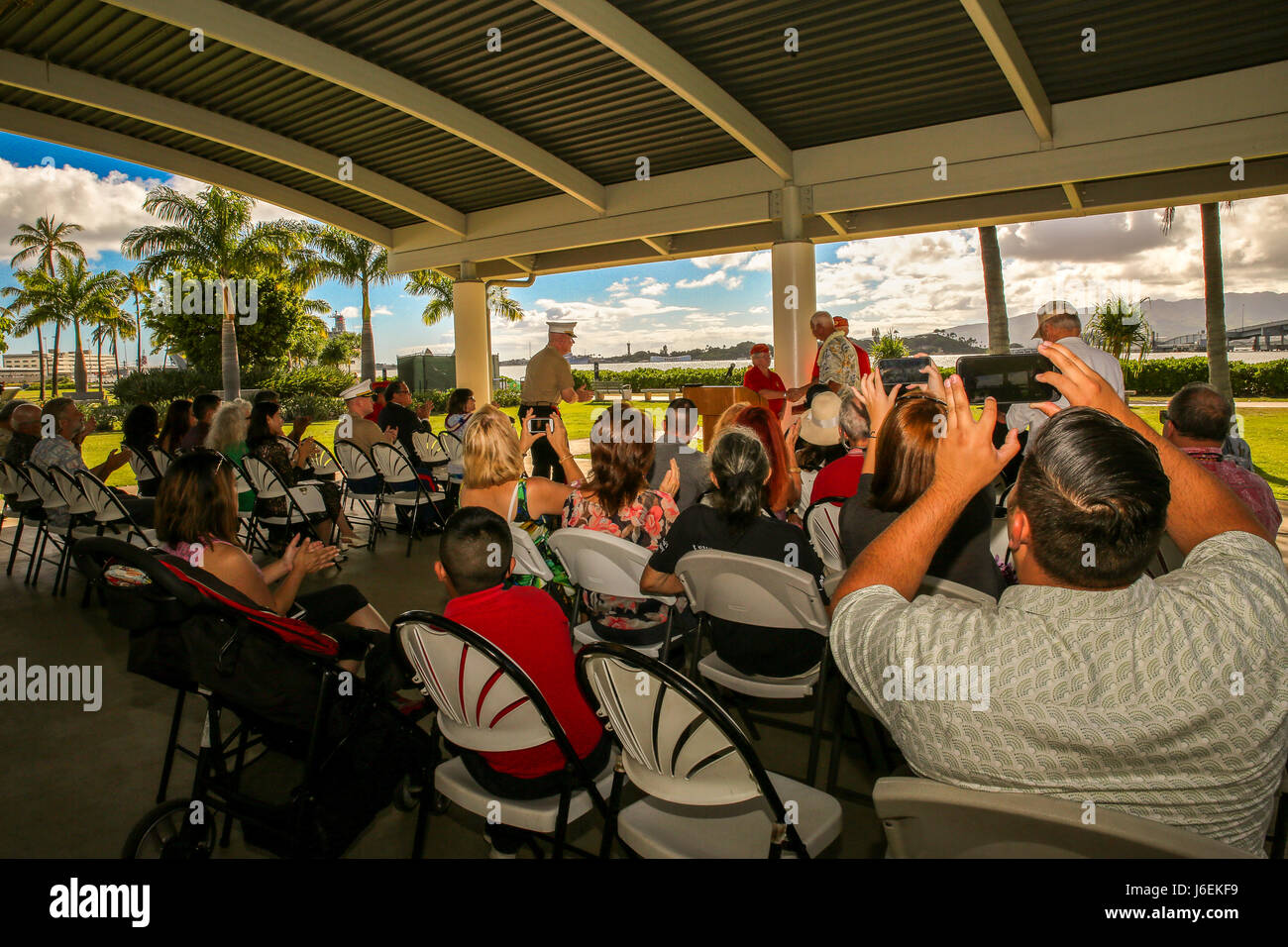 A Marine participates in the rededication ceremony at the USS Arizona ...
