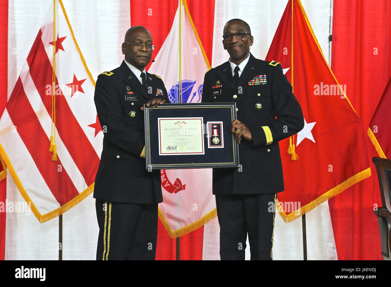 Brig. Gen. Renwick L. Payne (right) receives a Distinguished Service ...