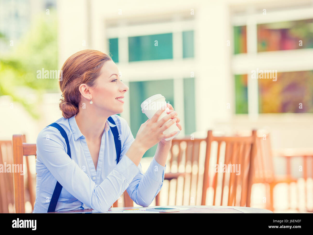 Side profile portrait young smiling woman drinking coffee outside ...