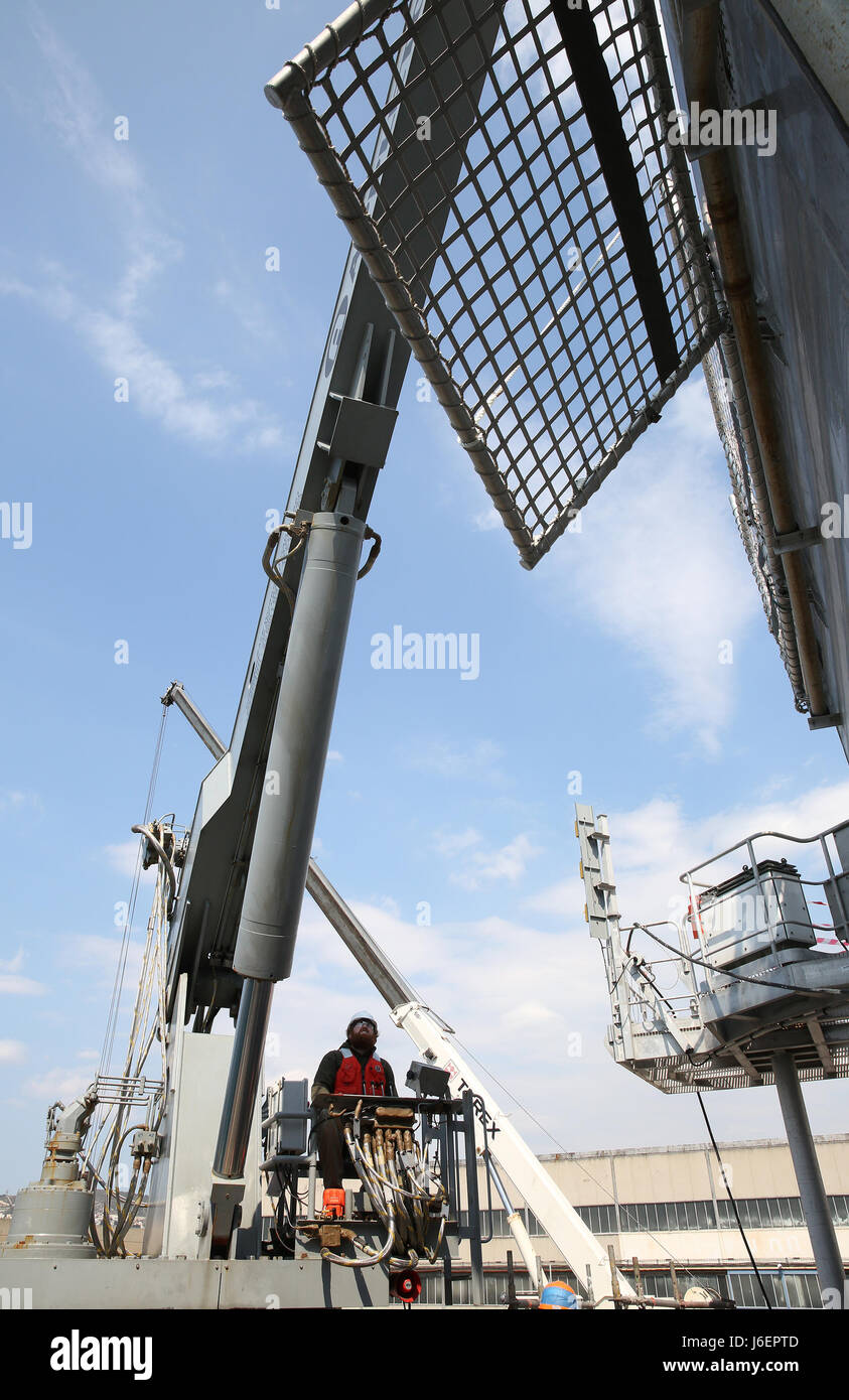 Joseph Blair, USNS Trenton third engineer, repositions a crane so ...