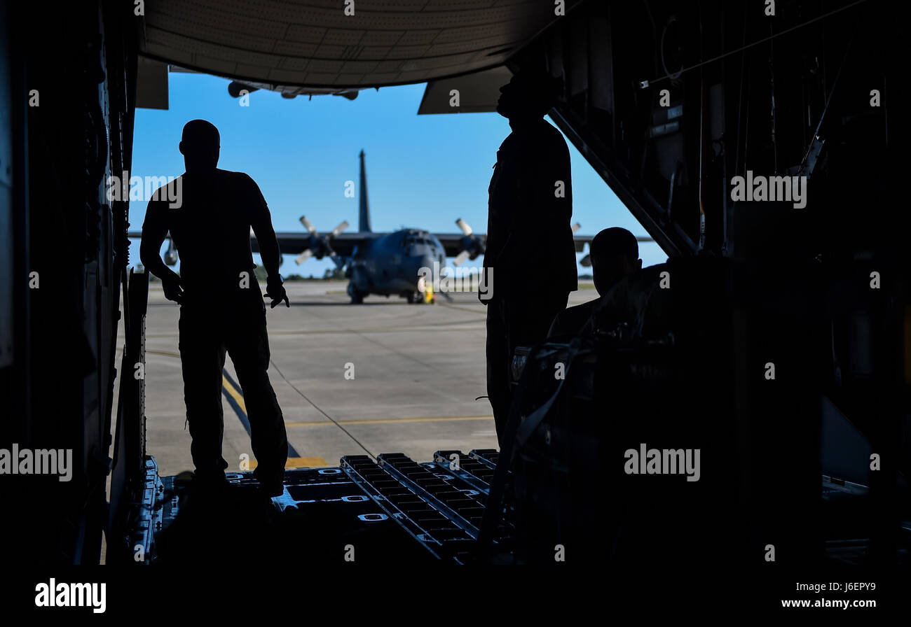 Loadmasters with the 15th Special Operations Squadron secure pallets on ...