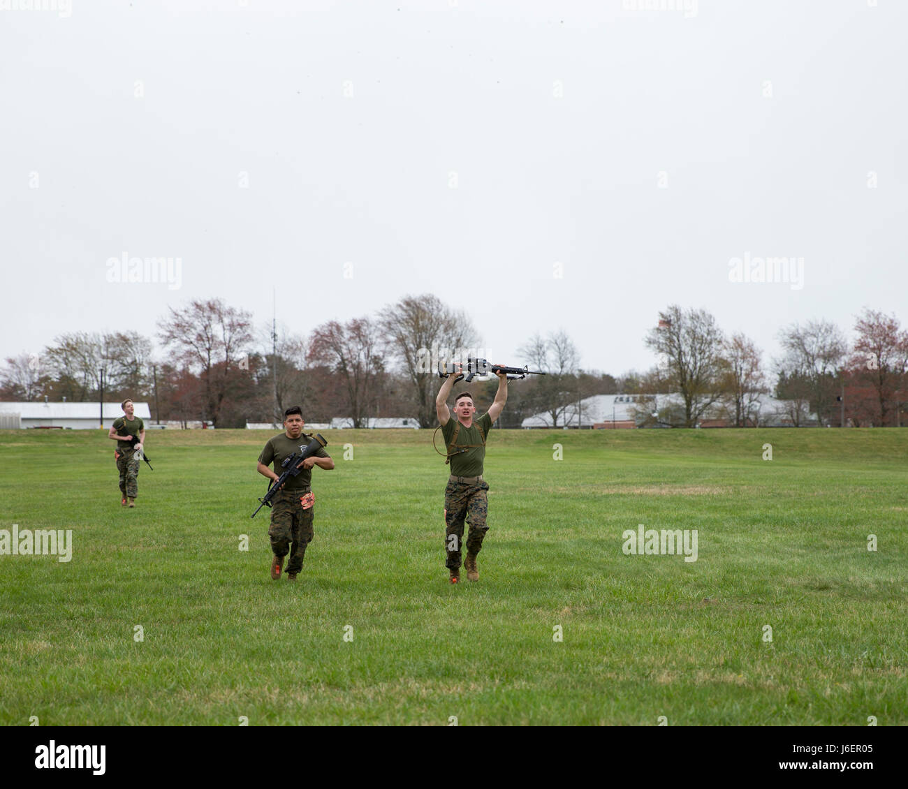 U.S. Marines with The Basic School (TBS) run down range during the ...