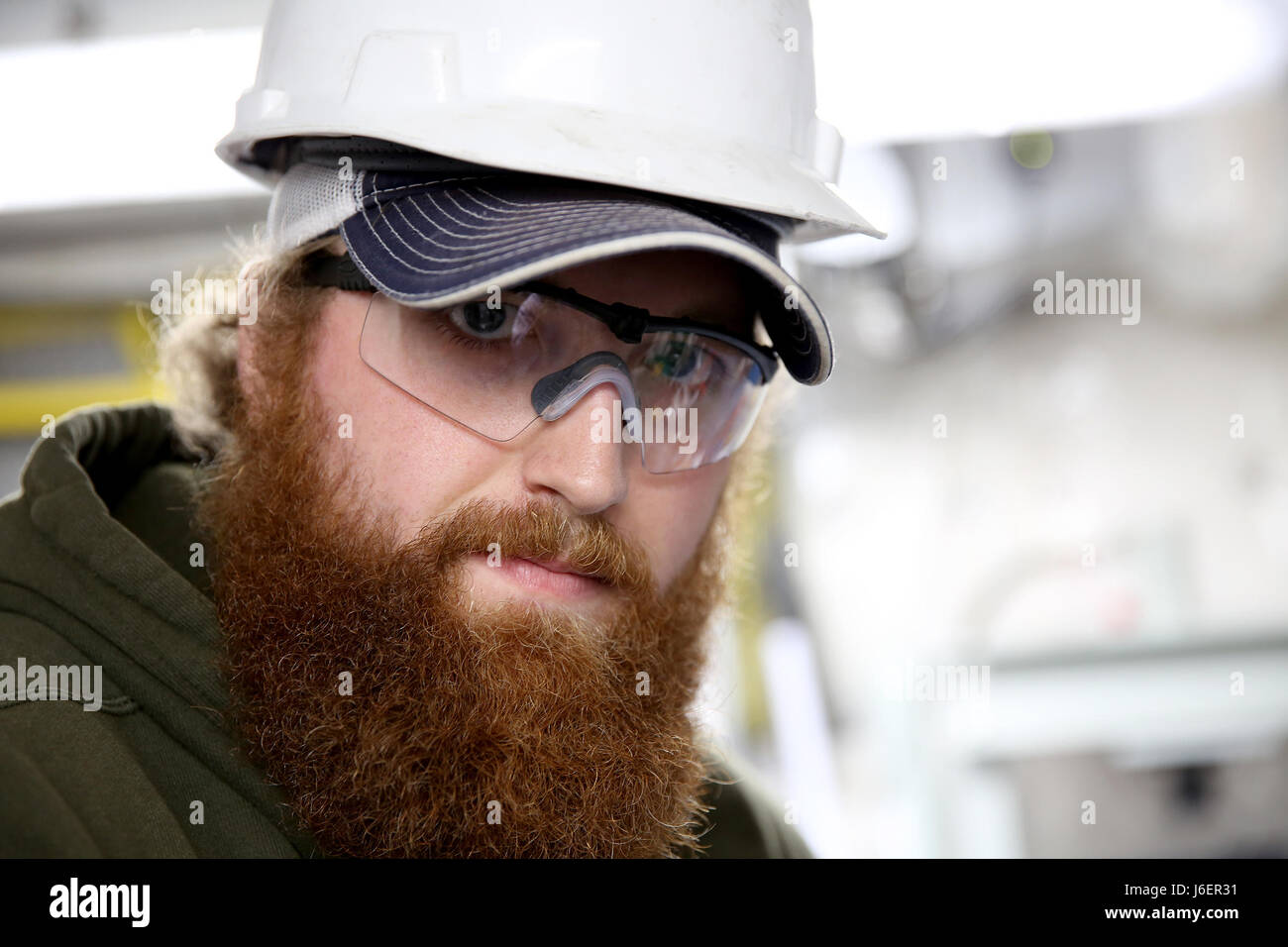 Joseph Blair, USNS Trenton third engineer, replaces cables during an ...