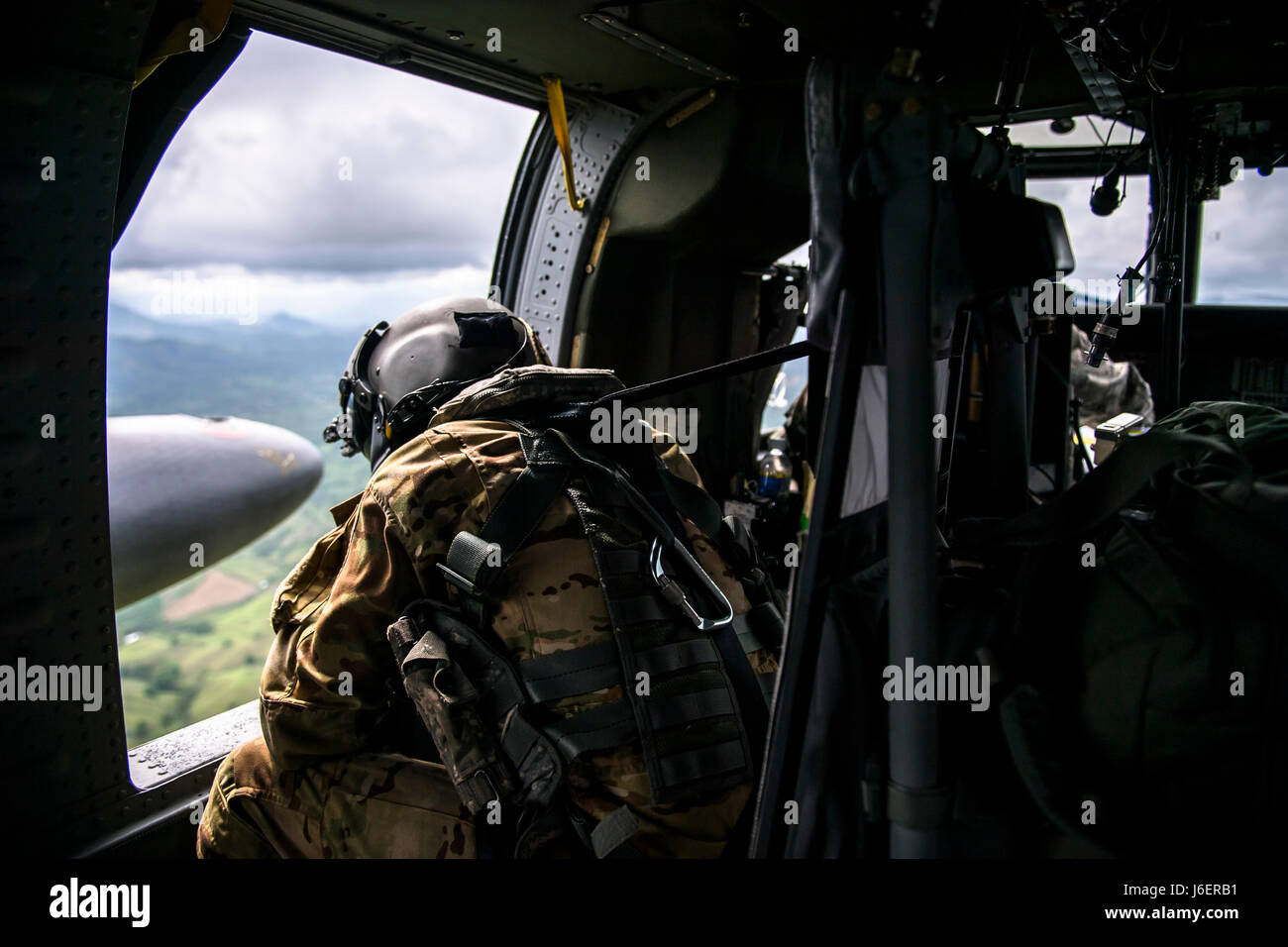 A U.S. Army crew chief conducted safety checks on a UH-60 Blackhawk ...