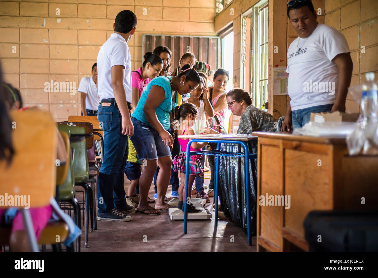 U.S. Army LTC. Rhonda Dyer provides deworming and preventive medication ...