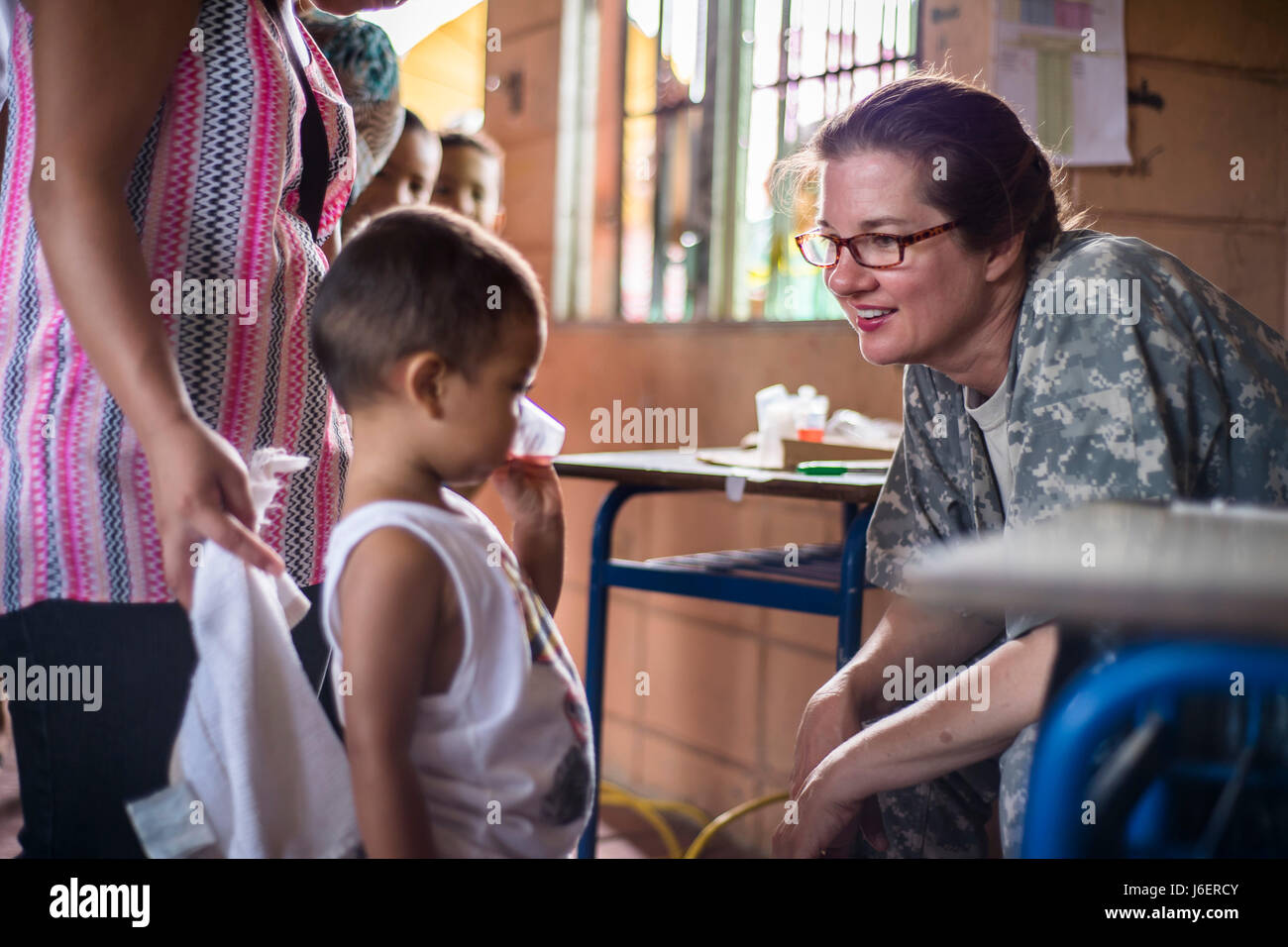 U.S. Army LTC. Rhonda Dyer provides deworming and preventative ...