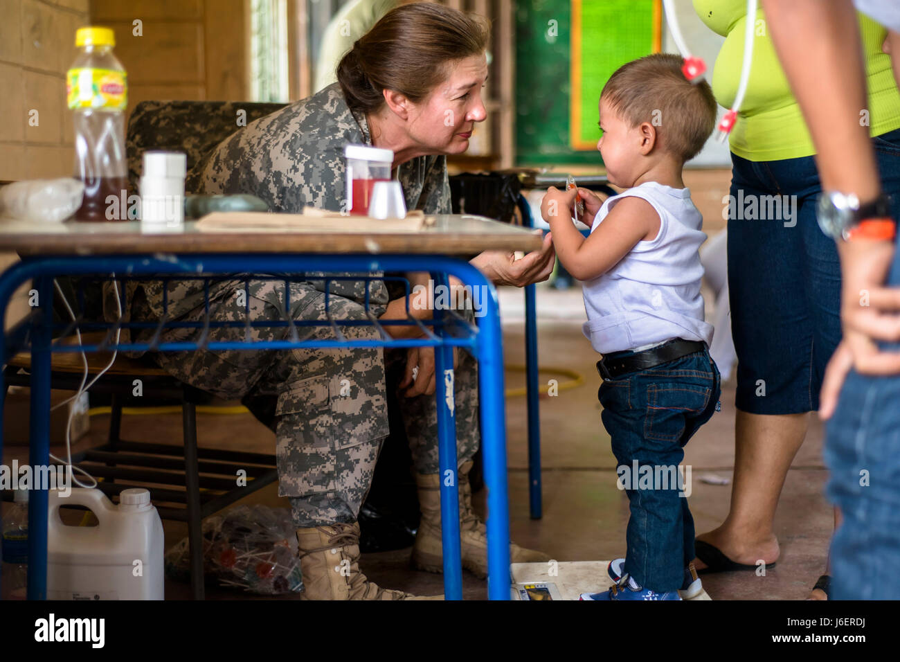 U.S. Army LTC. Rhonda Dyer provides deworming and preventative ...