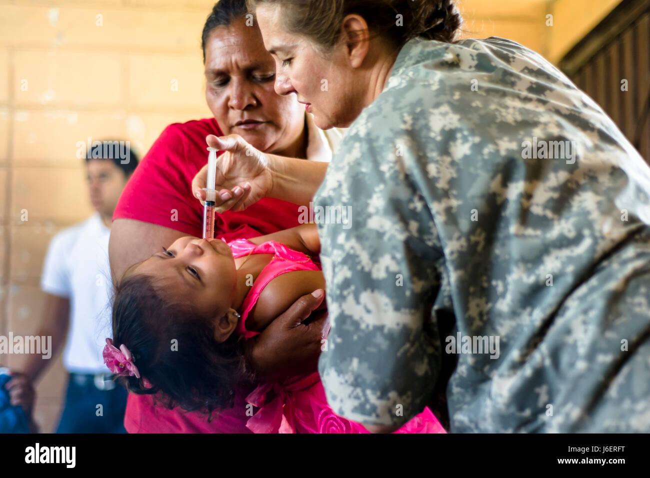 U.S. Army LTC. Rhonda Dyer provides deworming and preventative ...
