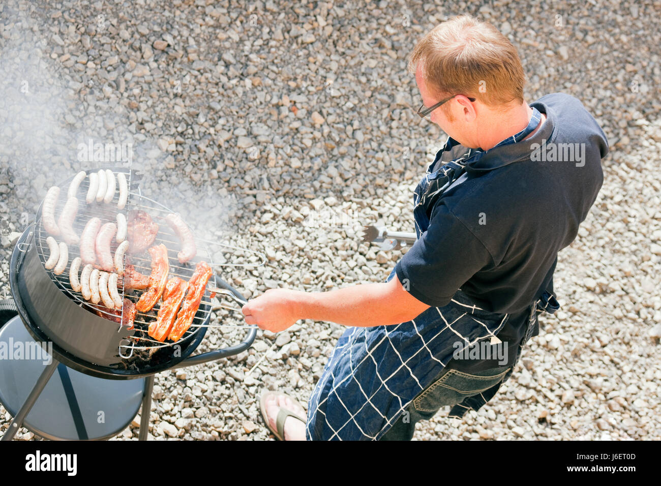 man at grill Stock Photo - Alamy