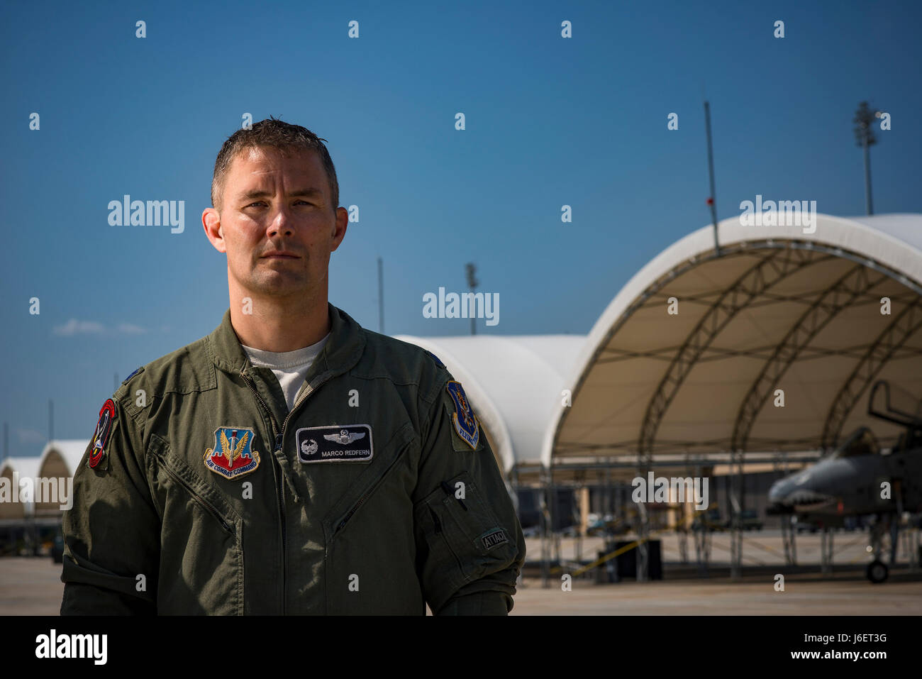 Lt. Col. Aaron “Marco” Redfern, 75th Fighter Squadron commander, poses ...