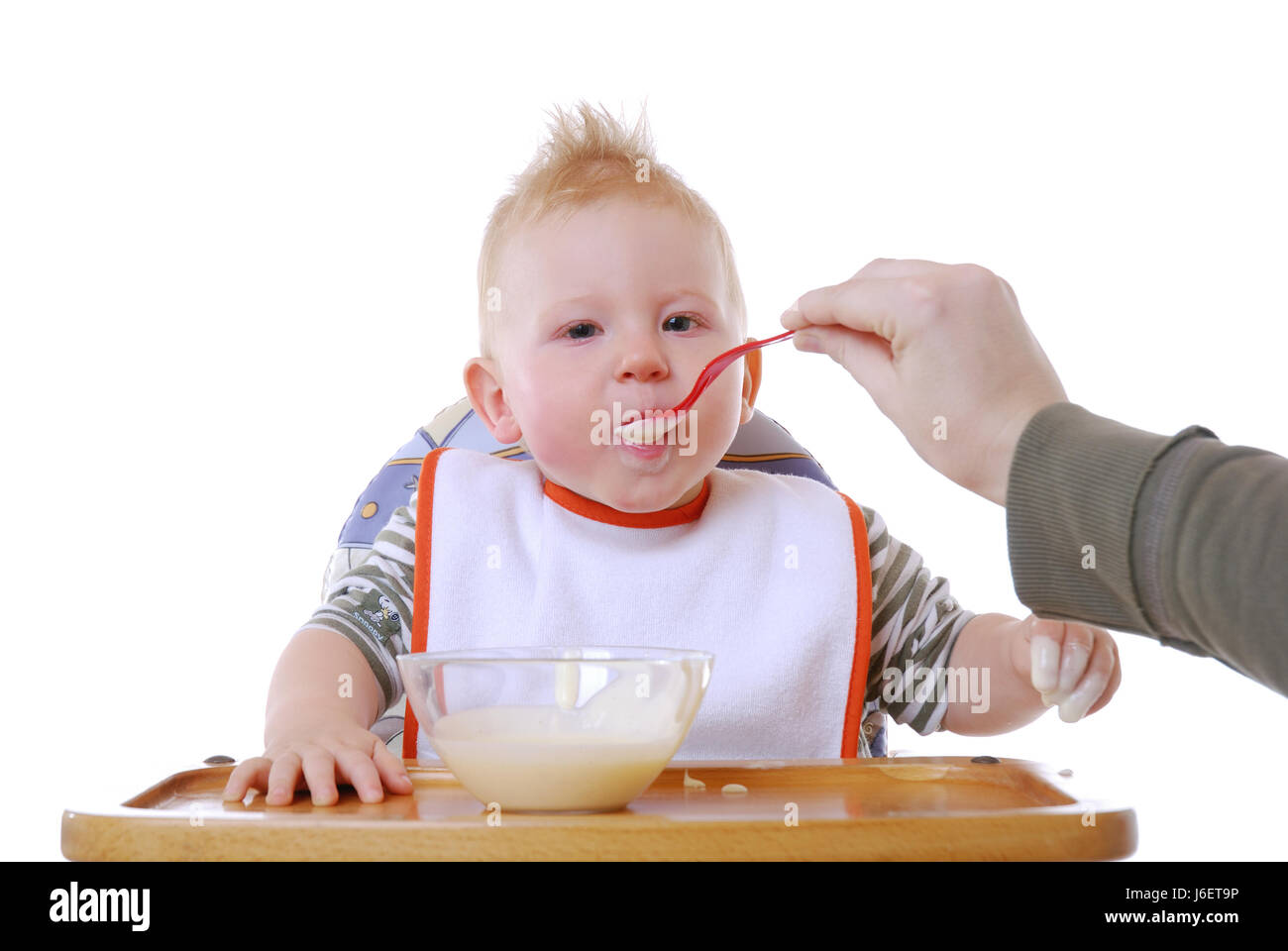 baby feed pap young younger child eating eat eats chair toddler studio ...