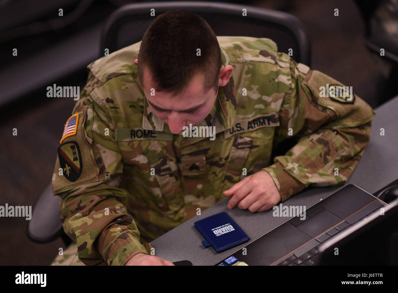 Louisiana National Guard Soldier Sgt. Austin Rome studies the spread of ...