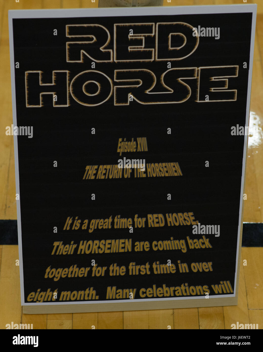 A homecoming sign greets Airmen from the 554th RED HORSE Squadron and ...