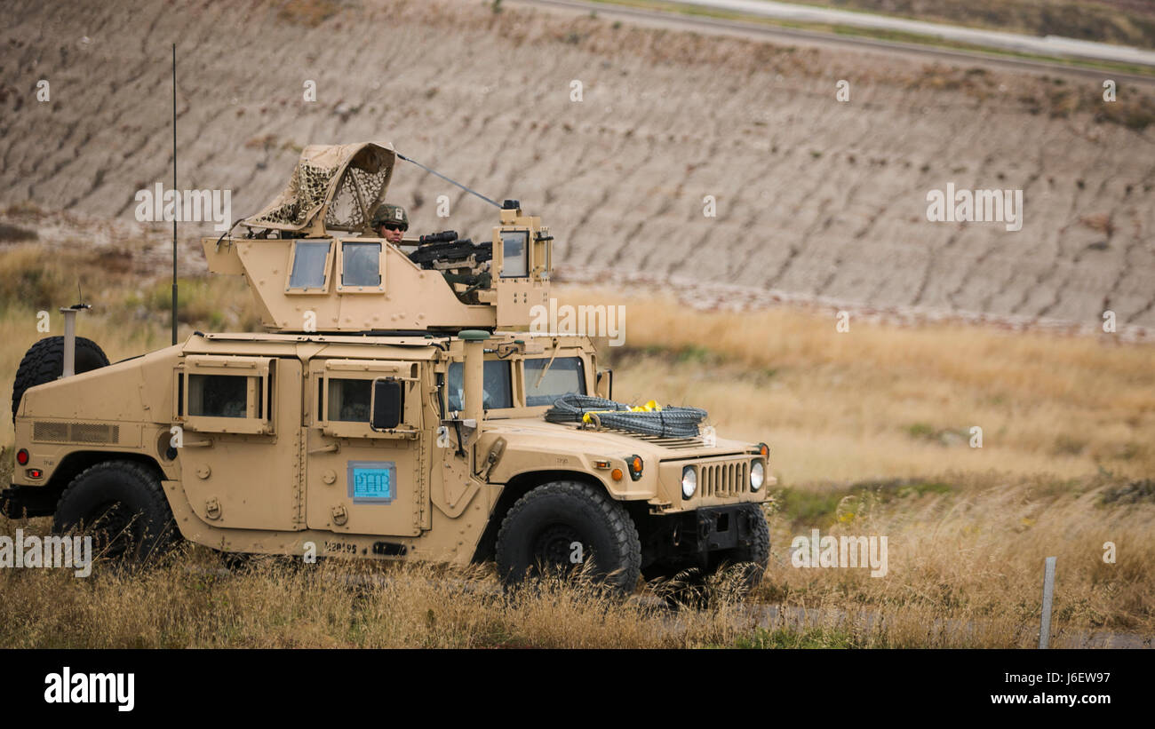 Marines from Combat Logistics Battalion 15 provide convoy security from ...
