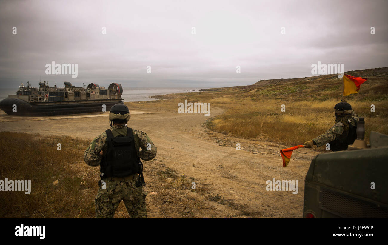 Sailors from Beachmaster Unit 1 provide terminal guidance to a Landing ...