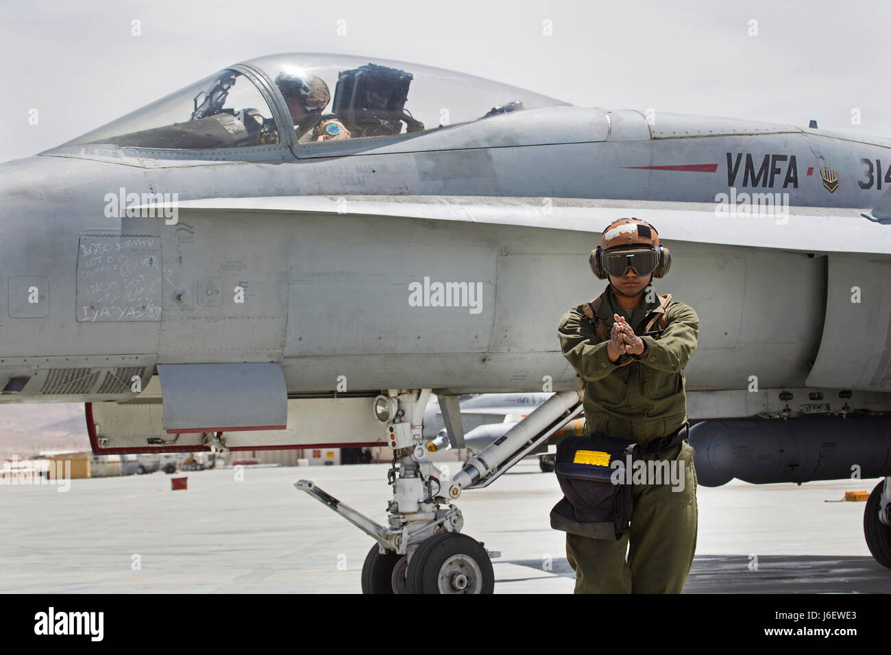 Marines with Marine Fighter Attack Squadron (VMFA) 314, taxi an F/A-18C ...