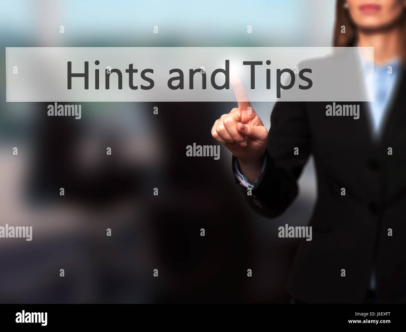 Hints and Tips - Businesswoman pressing modern buttons on a virtual ...