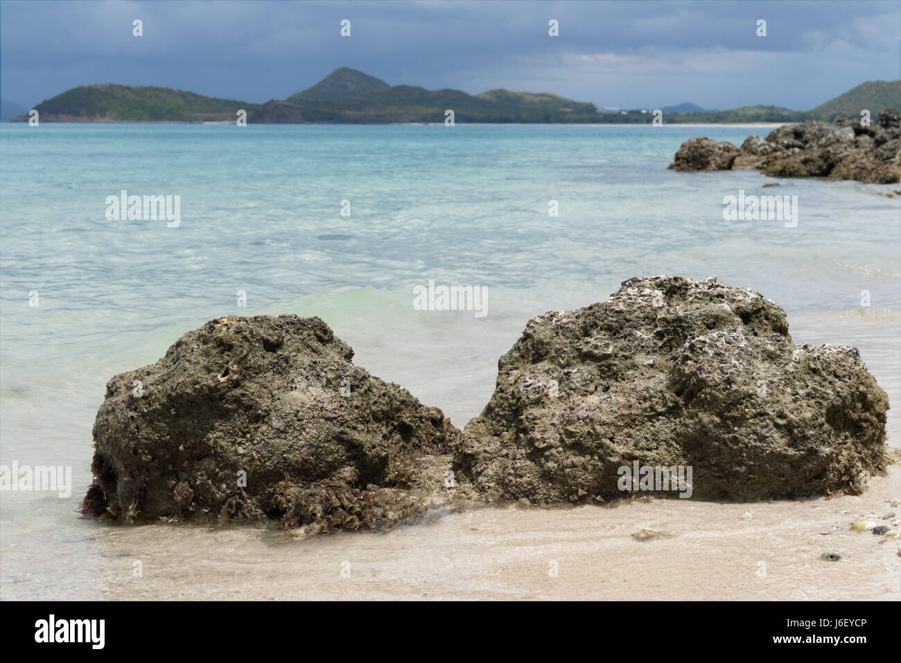 Rock on the beach with sea Stock Photo - Alamy