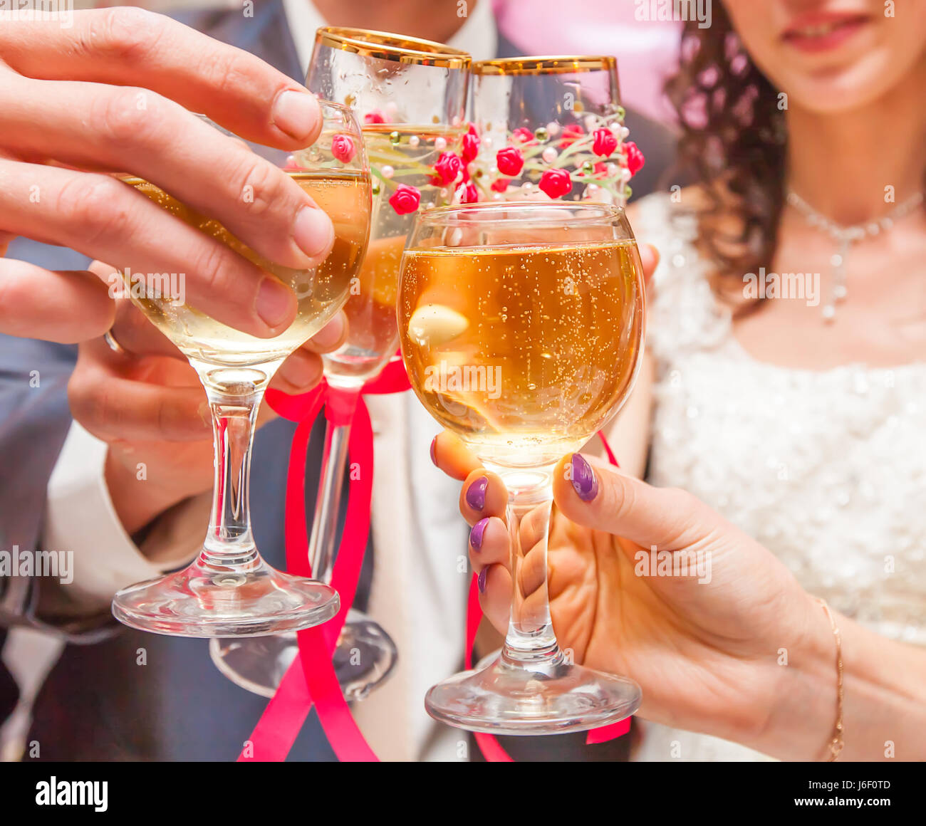 Reception bride and groom with champagne and wine Stock Photo - Alamy