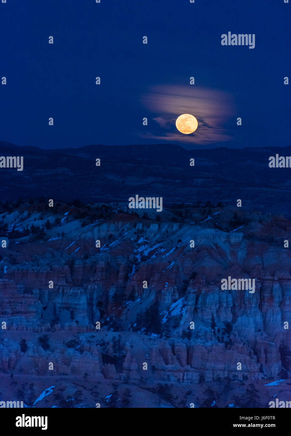 Blue Moon over Bryce Canyon with traces of snow on hoodoos Stock Photo ...