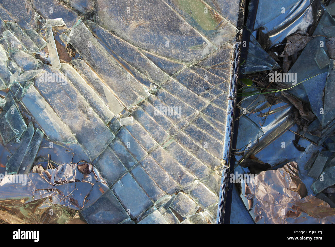 Vandals smashed the glass windows of the unfinished unguarded abandoned ...