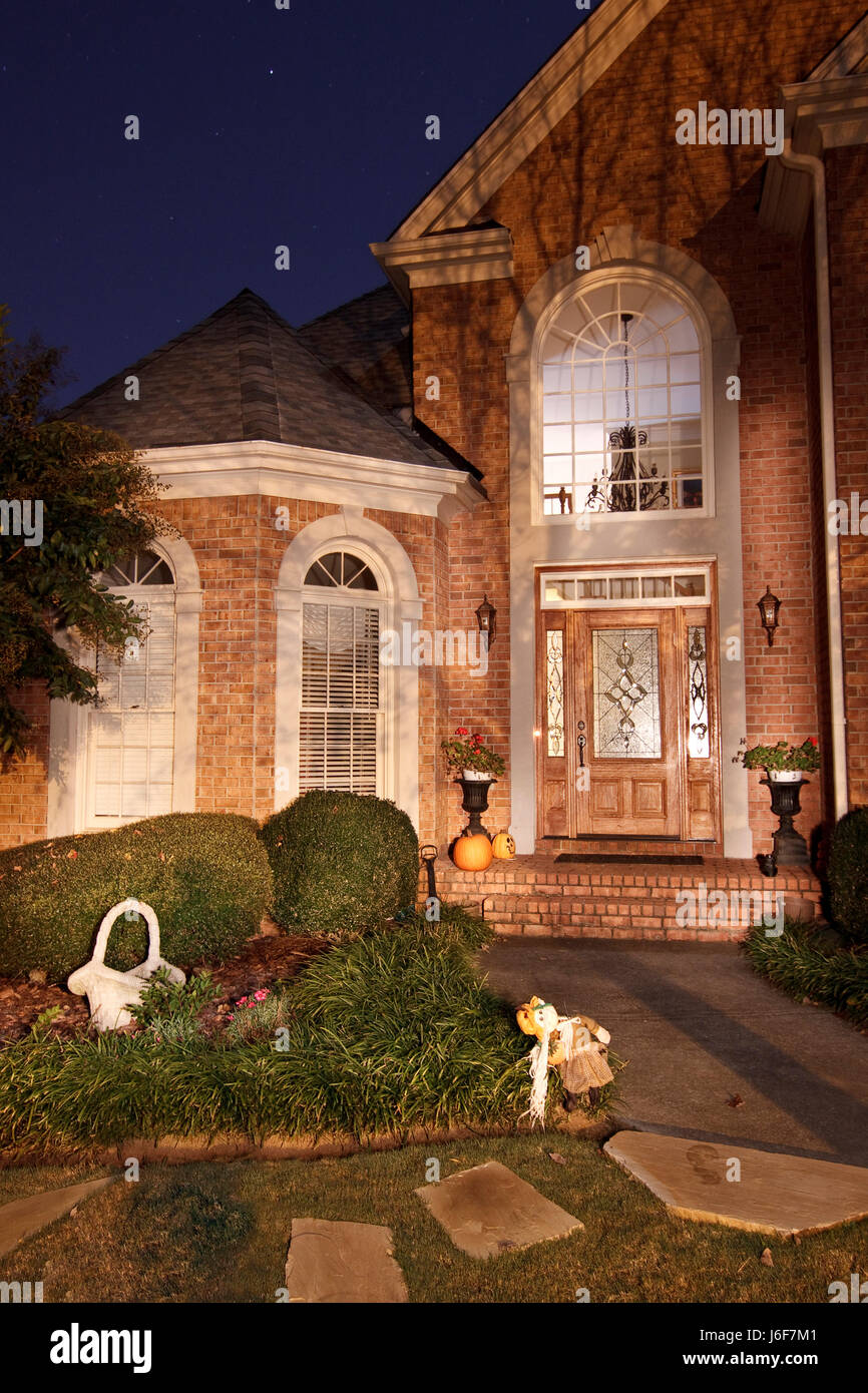 house building night nighttime entrance brick style of construction ...