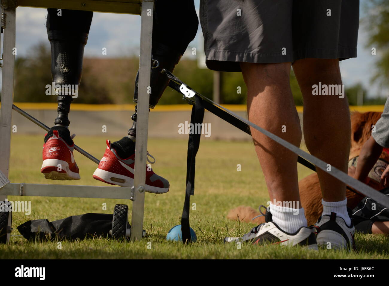 Christy Gardner, 2017 Paralympics competitor, receives advice from one ...