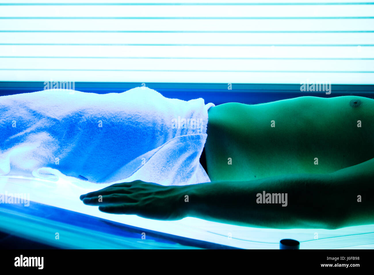 man in the solarium Stock Photo - Alamy