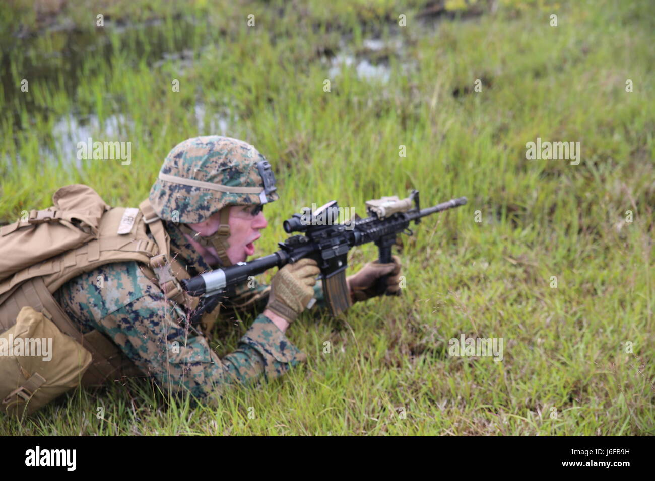 A Marine issue orders to his squad during a fire team training exercise ...