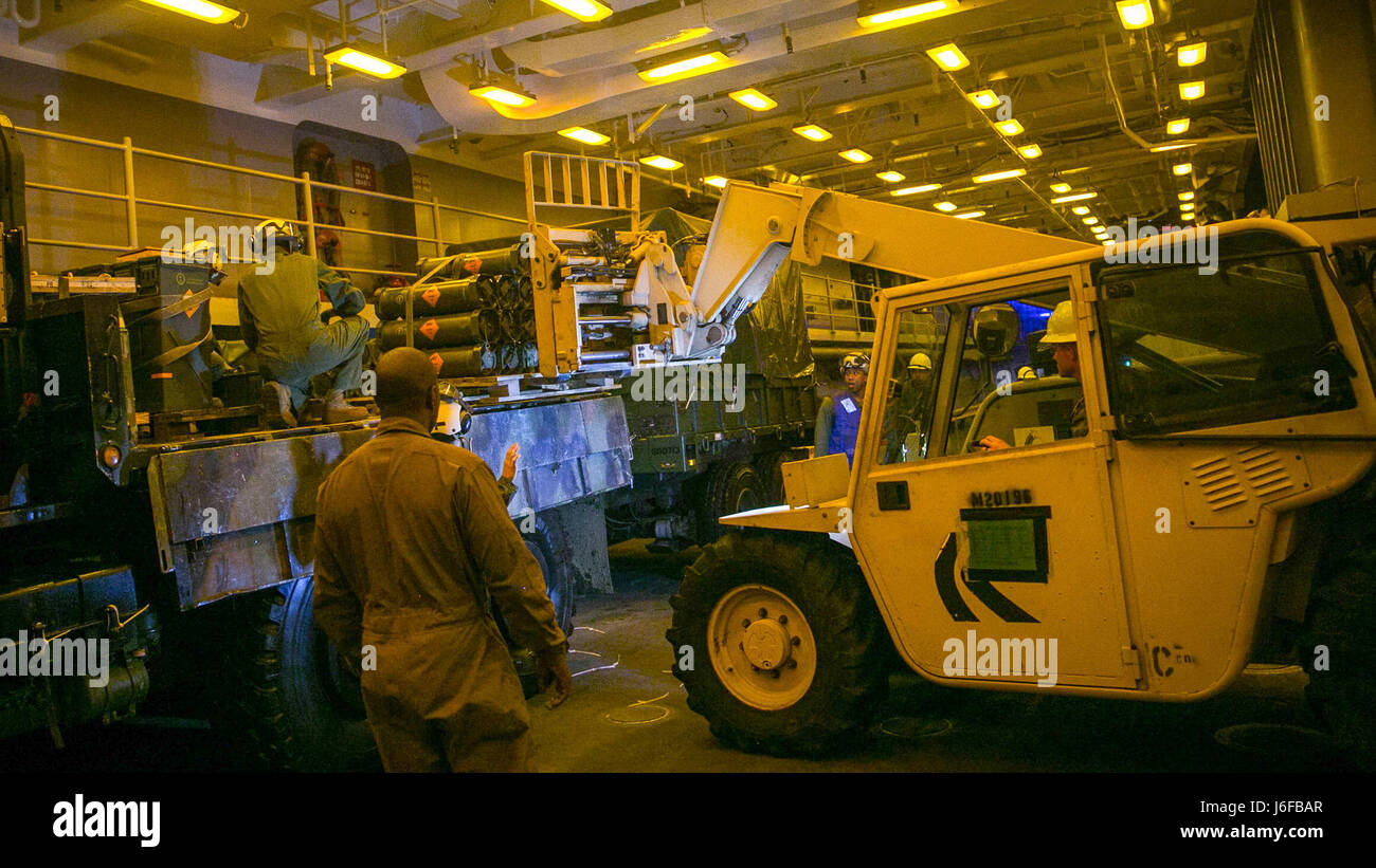 A heavy machine operator from Combat Logistics Battalion 15 offloads ...