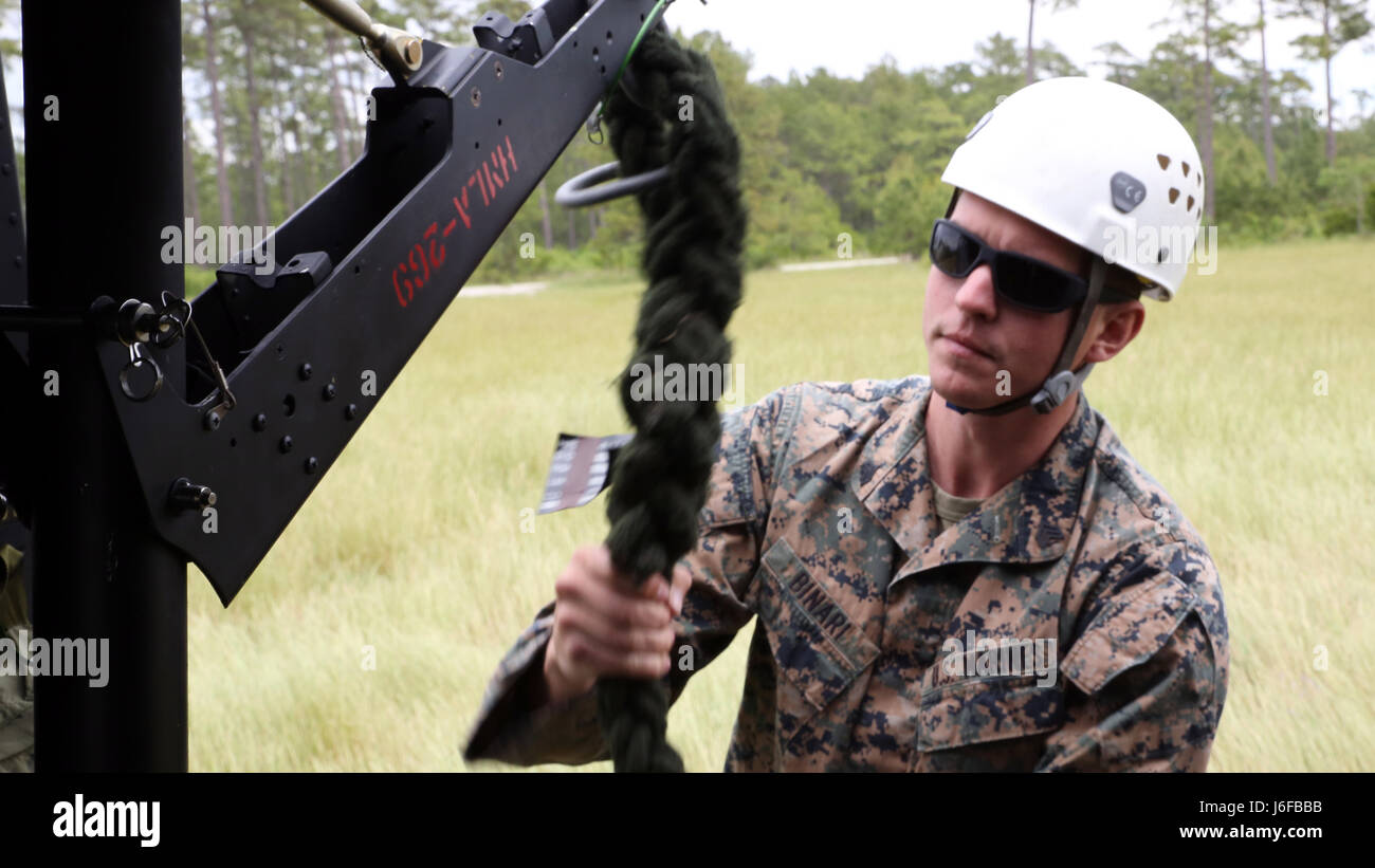A 90-foot rope is prepared on a UH-1Y Venom helicopter for fast-rope ...