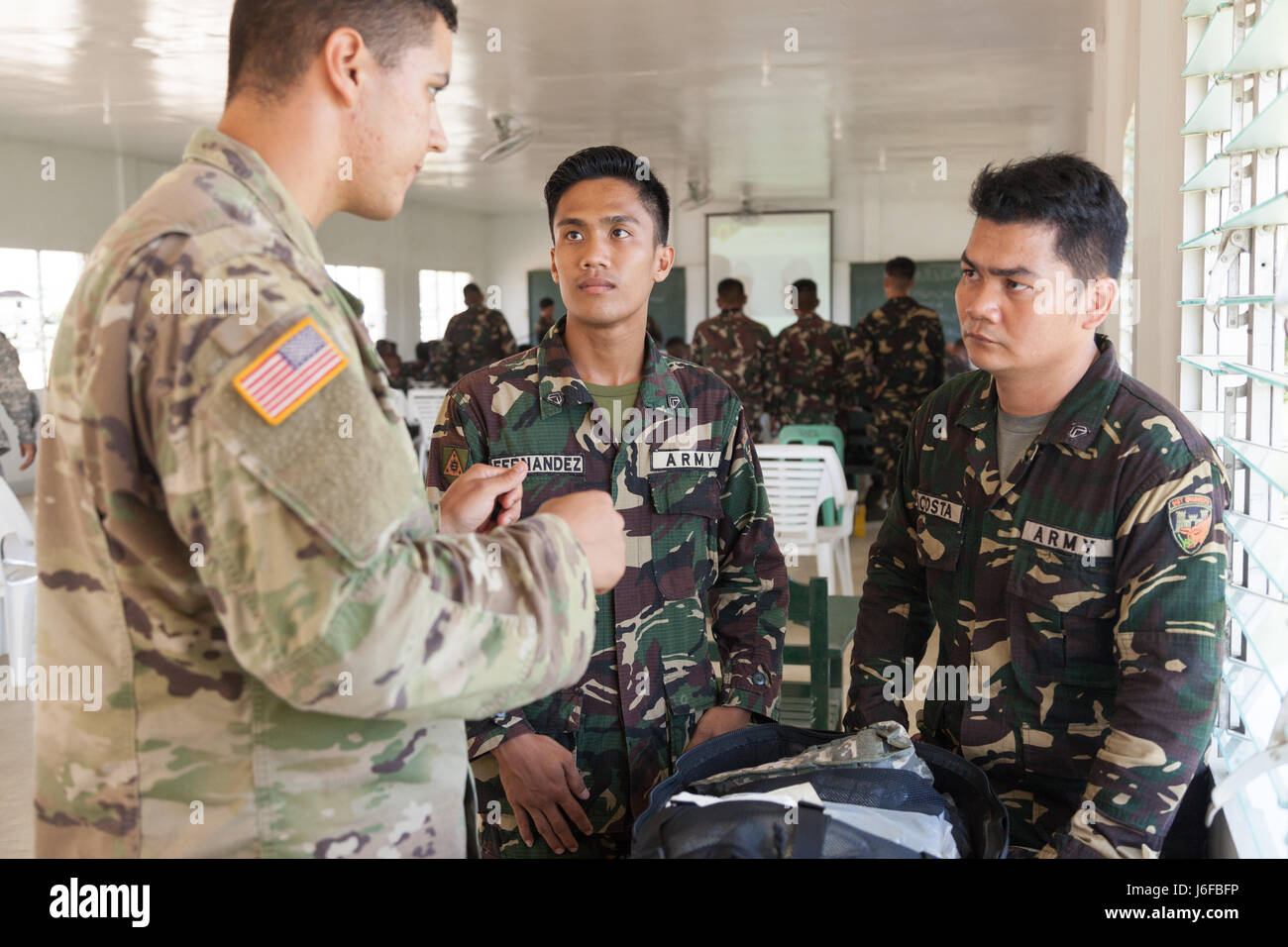 U.S. Army Sgt. Louis Guzman, left, discusses first aid and medical ...