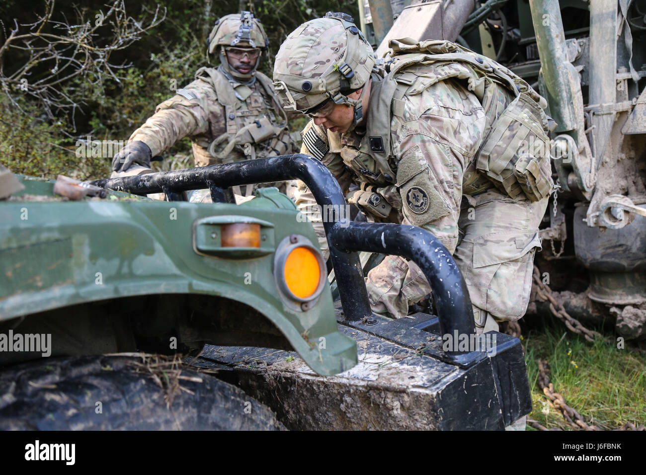 U.S. Soldiers of 4th Squadron, 2d Calvary Regiment connect a Humvee to ...