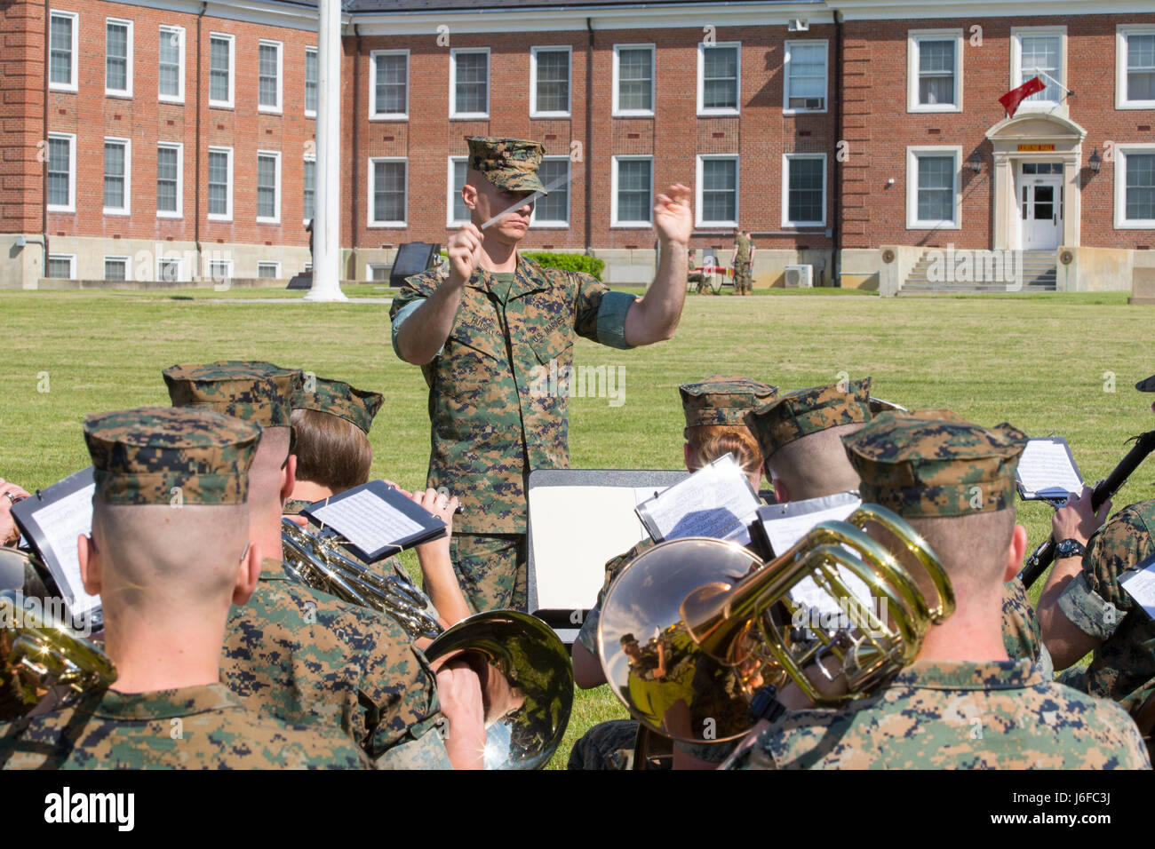 U.S. Marine Corps Gunnery Sgt. Kristofer P. Hutsell, center, enlisted ...