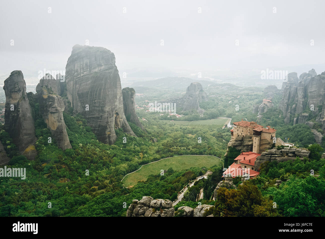 Fog landscape of Meteora Rocks , Greece Stock Photo - Alamy