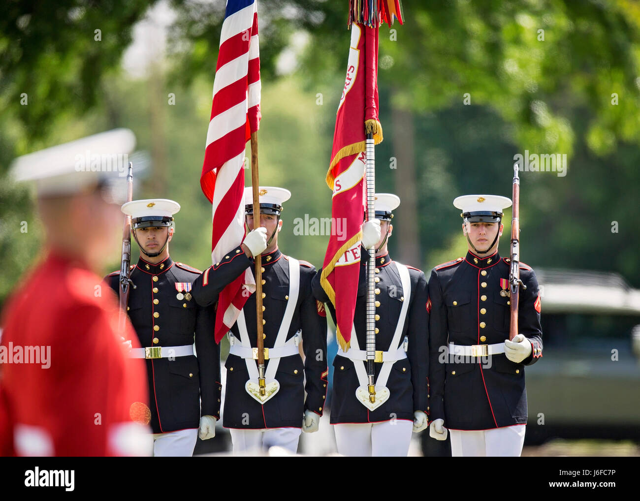 The U.S. Marine Corps Quantico Color Guard march on the colors during ...