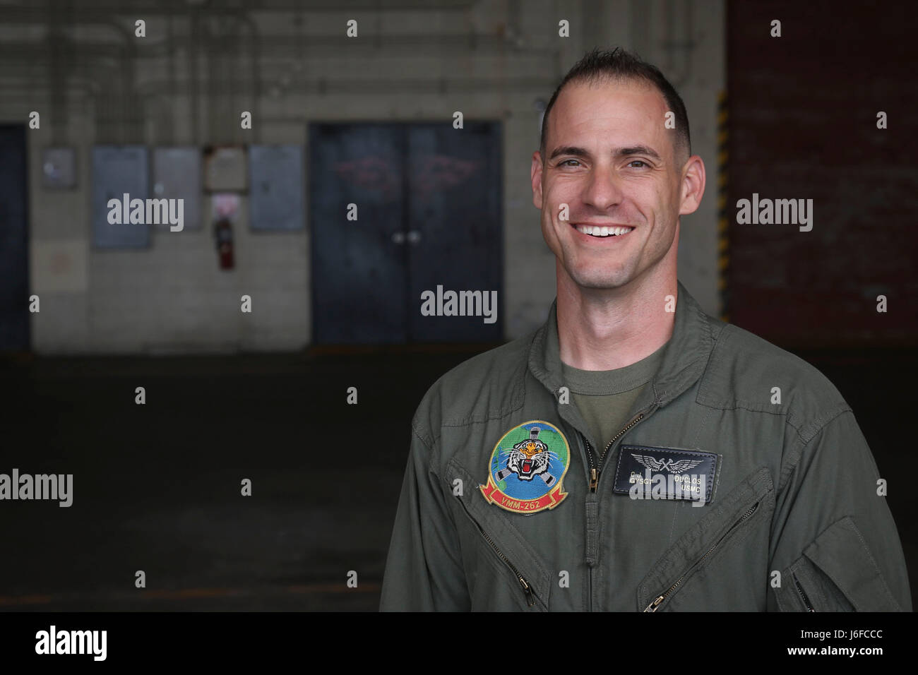 U.S. Marine Corps Gunnery Sgt. Clinton John DuClos receives the James ...
