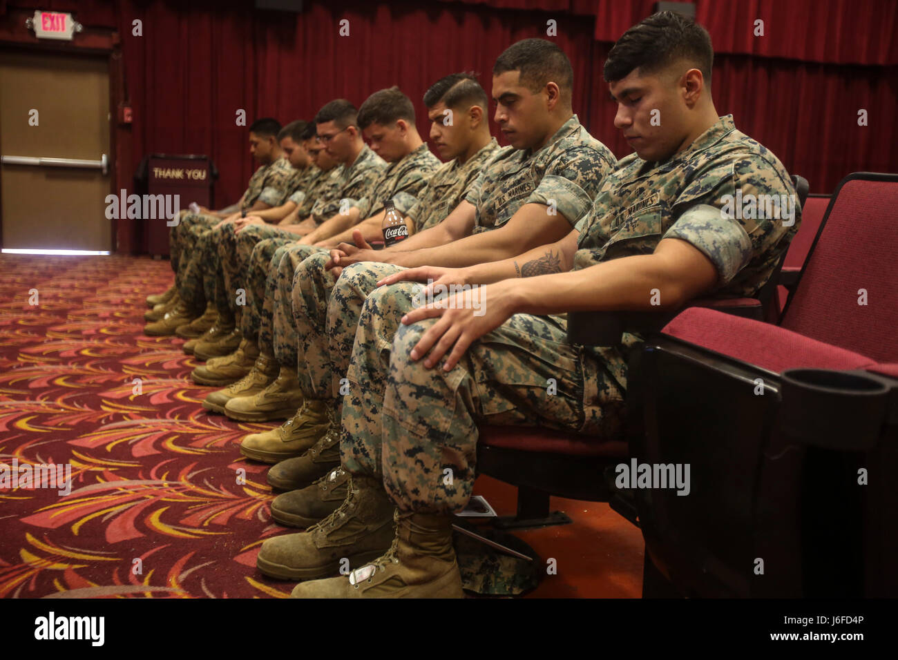 Marines bow their heads for prayer during the Solar Ready Vets ...