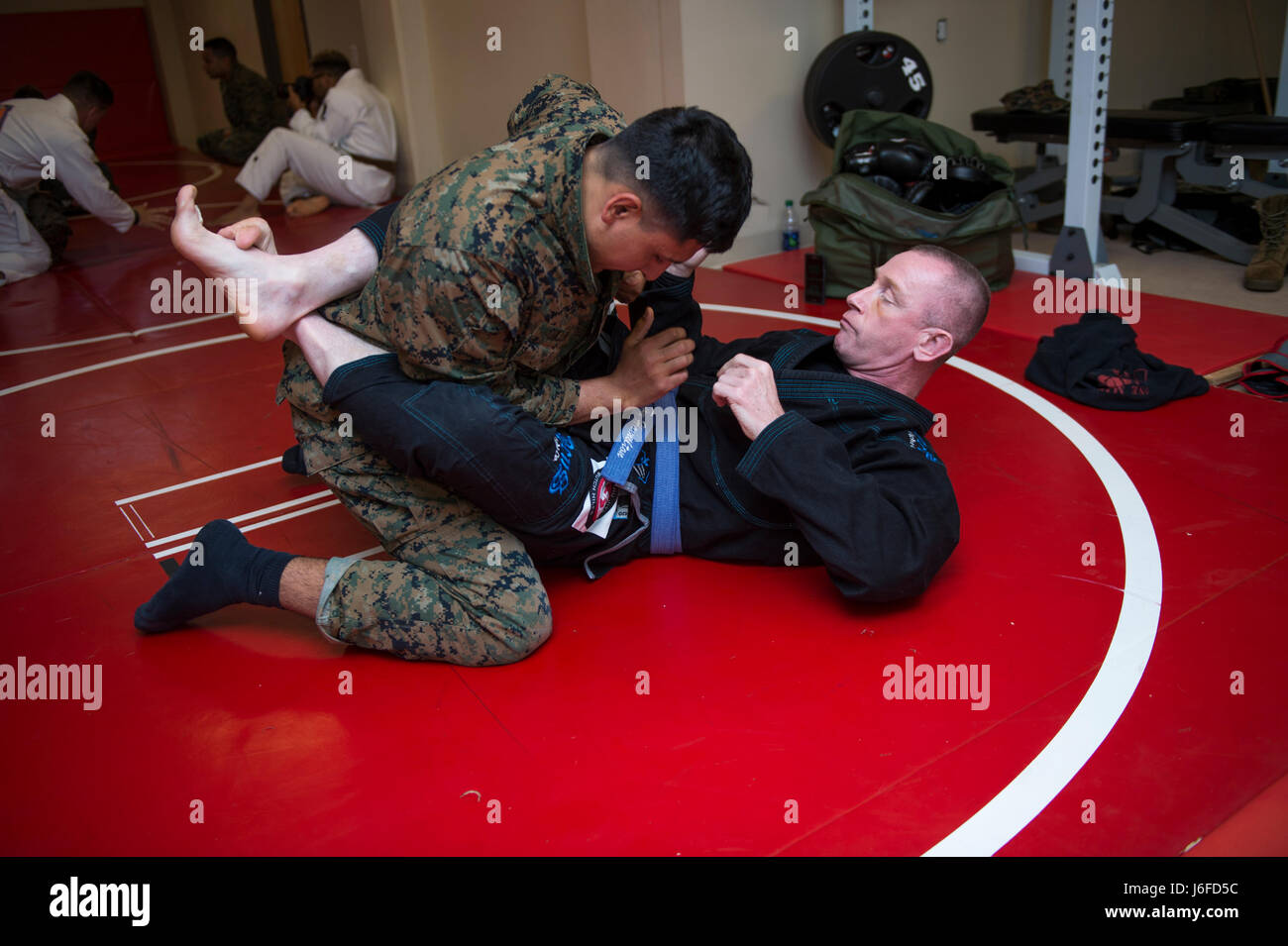 U.S. Marines practice Brazilian Jujitsu grappling techniques during a ...