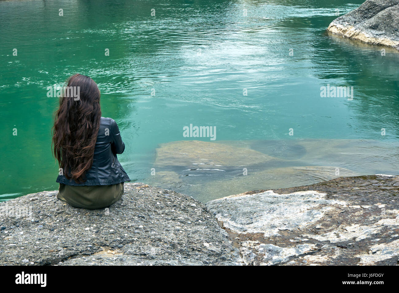 Girl enjoys the river view Stock Photo - Alamy