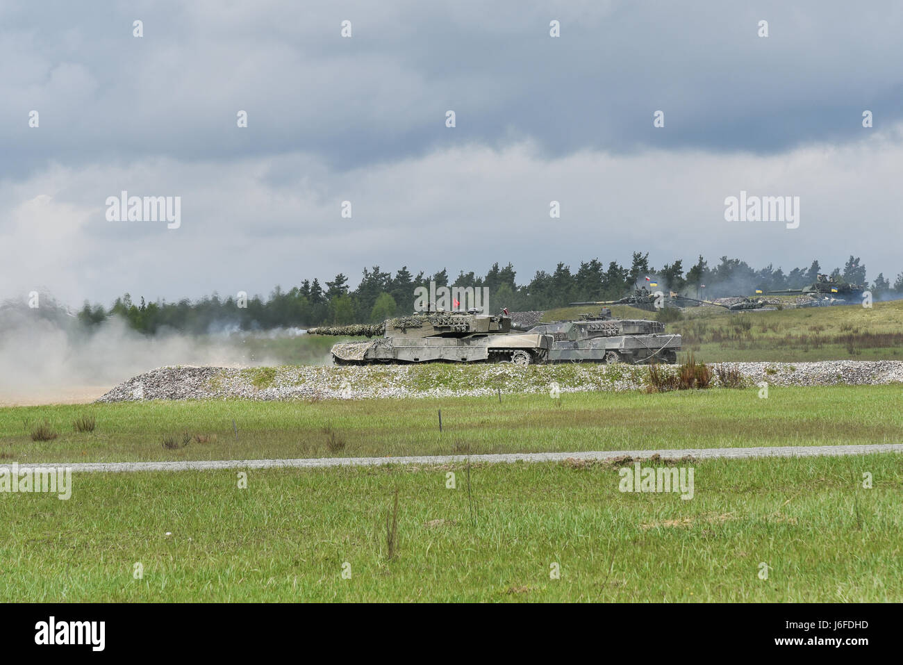 Tanks from six NATO nations fire at their targets during the Strong ...