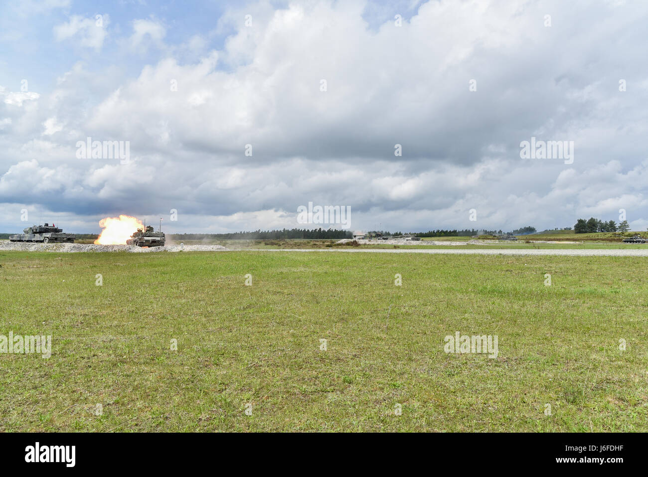 Tanks from six NATO nations fire at their targets during the Strong ...