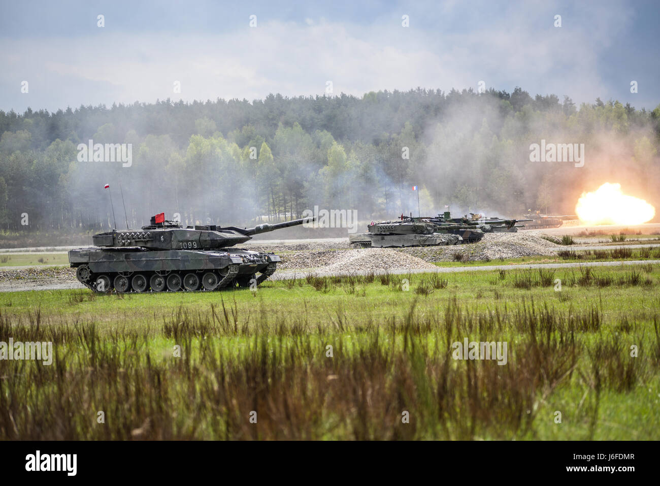 Tanks from six NATO and partner nations fire at their targets during ...